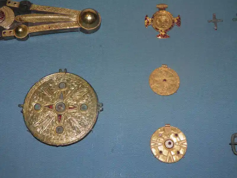 Gold solar cross pendants, from pagan to chrisitanity